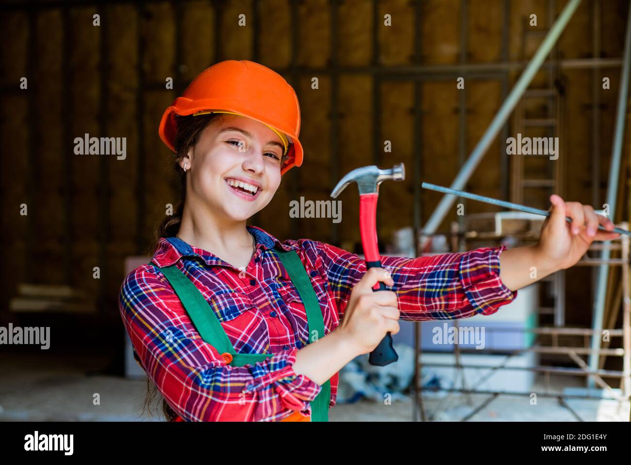 engineering education. future engineer. happy kid use hammer repairing ...