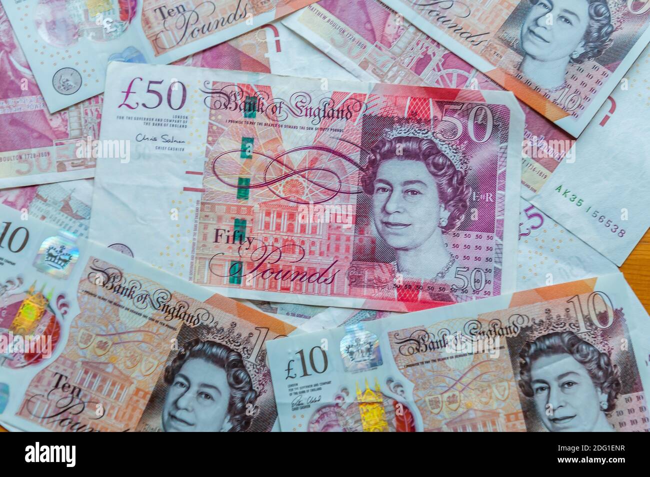 A close-up of British £50 banknotes,thread, watermark, microlettering ...