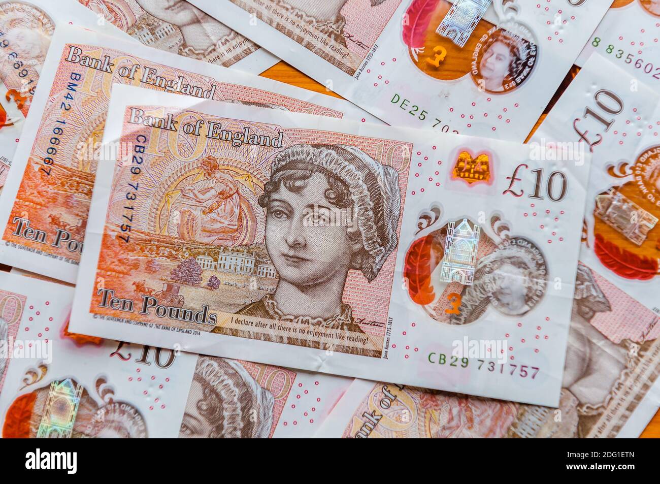 A close-up showing British ten banknotes finely detailed bronze ...