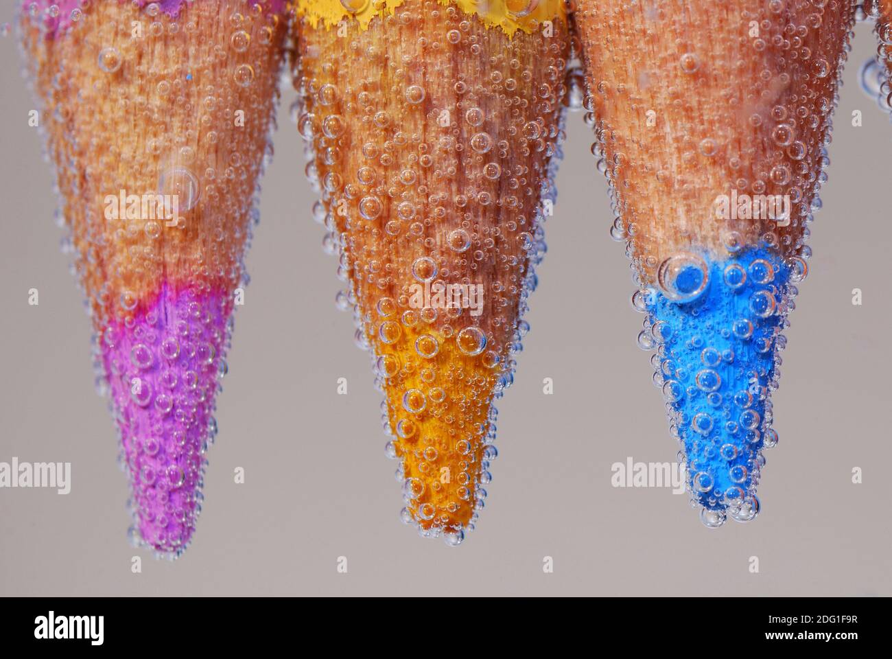 Three crayons with bubbles Stock Photo - Alamy