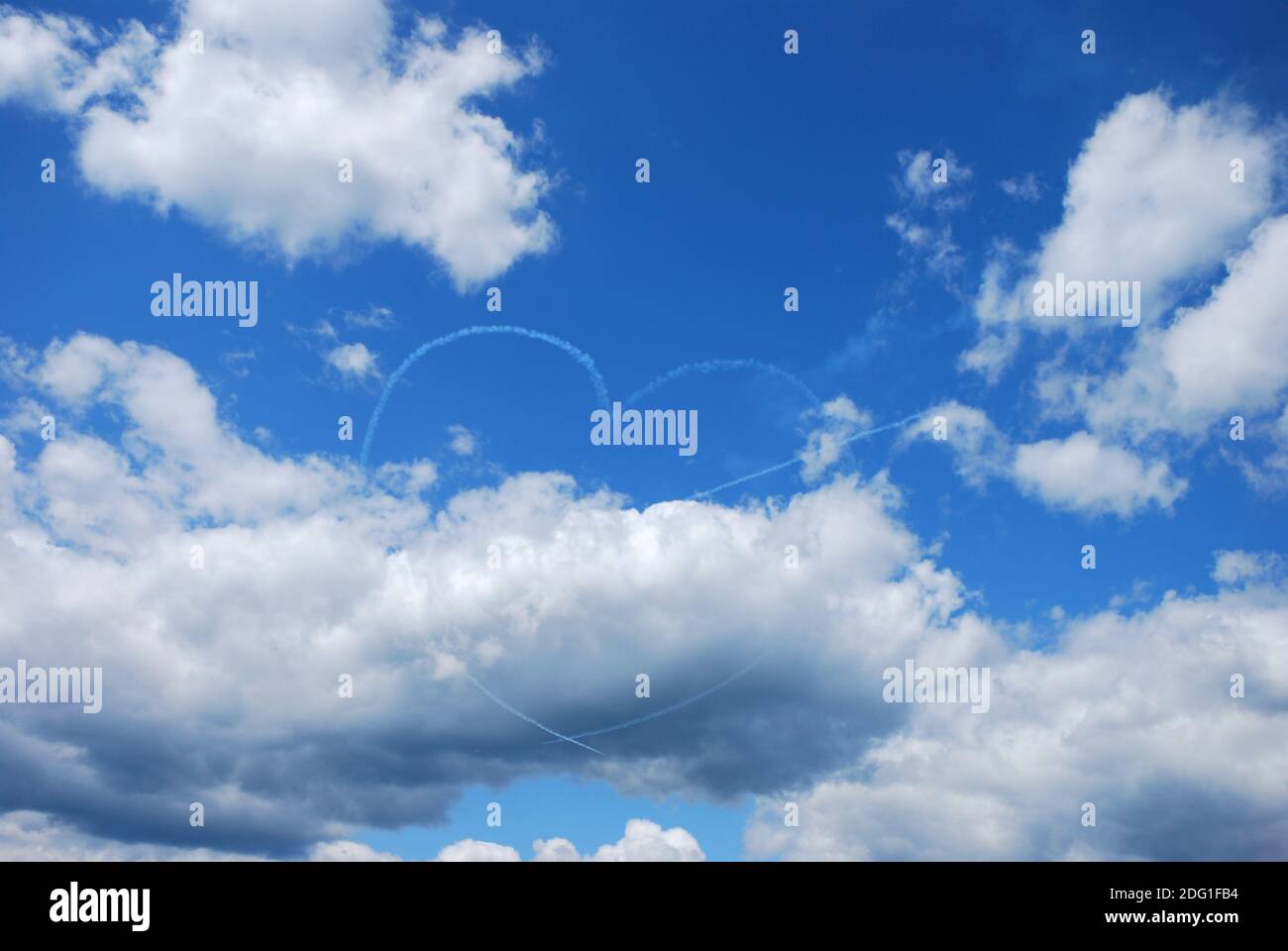 Plane flies heart Stock Photo - Alamy