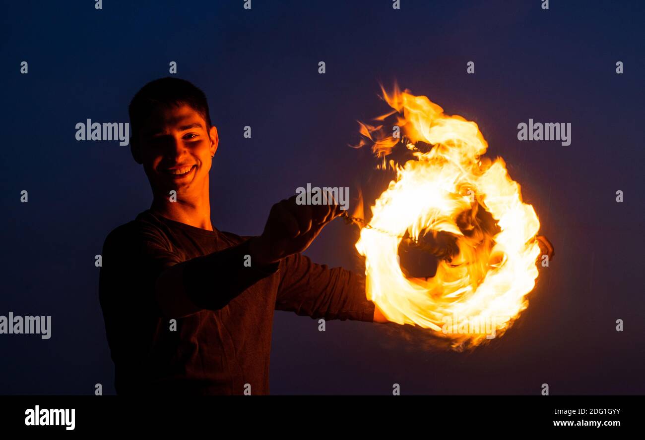 Fire twirler hi-res stock photography and images - Alamy