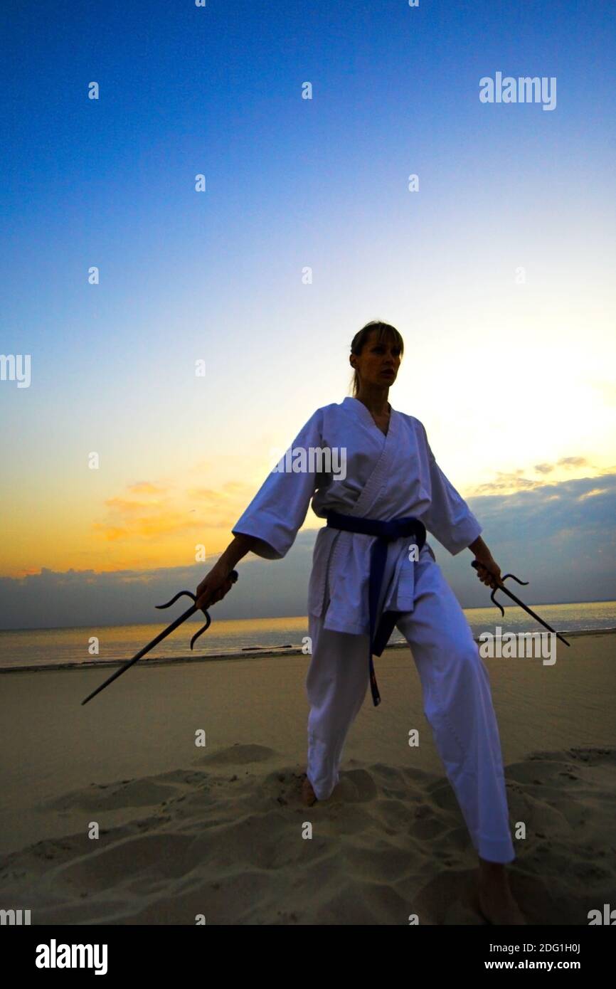 Karate on sunset beach Stock Photo - Alamy