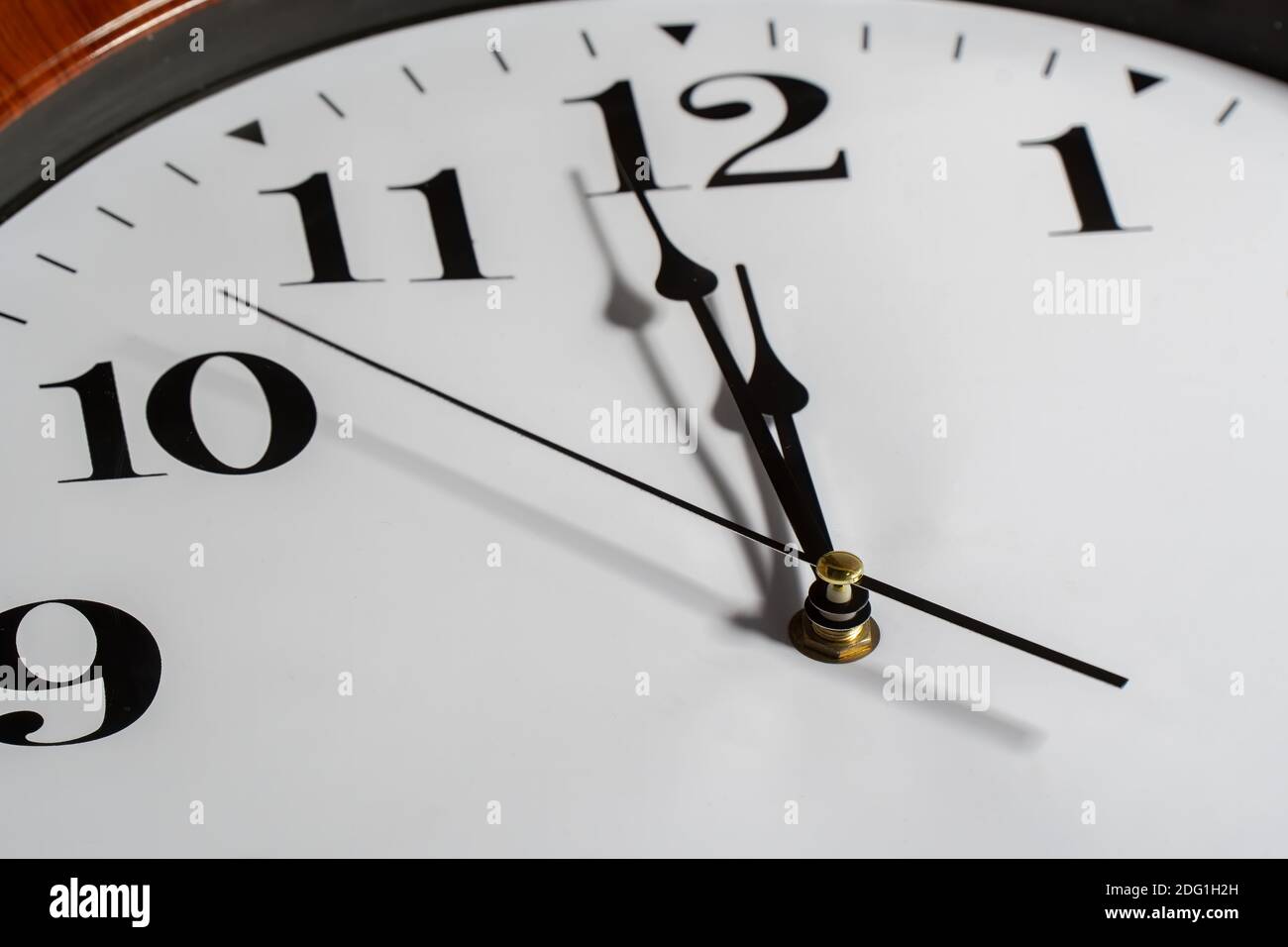 Close-up view on clock. Twelve o'clock Stock Photo - Alamy