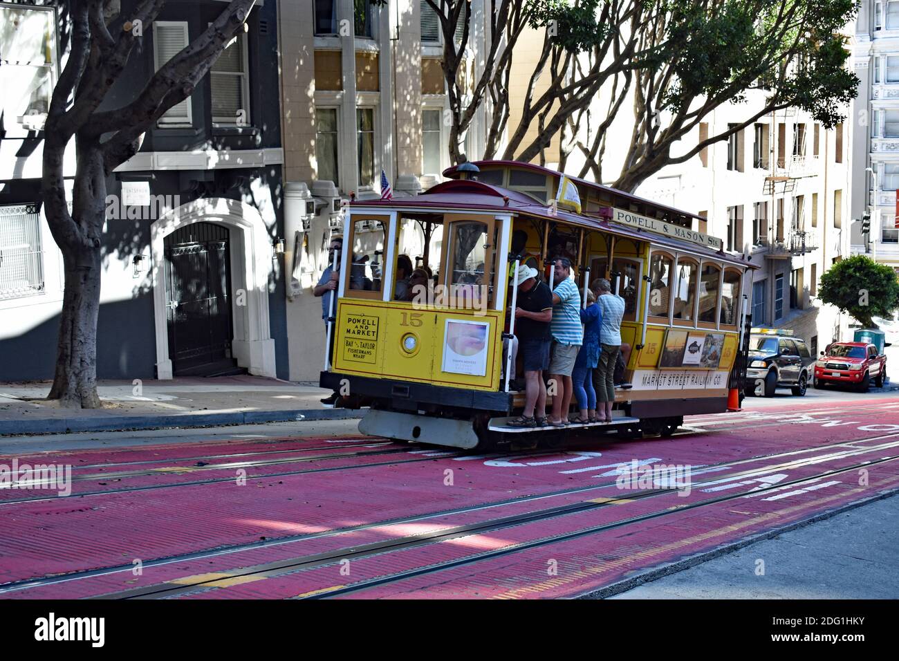 A Powell & Mason line cable car travels up the hill on Powell Street in ...