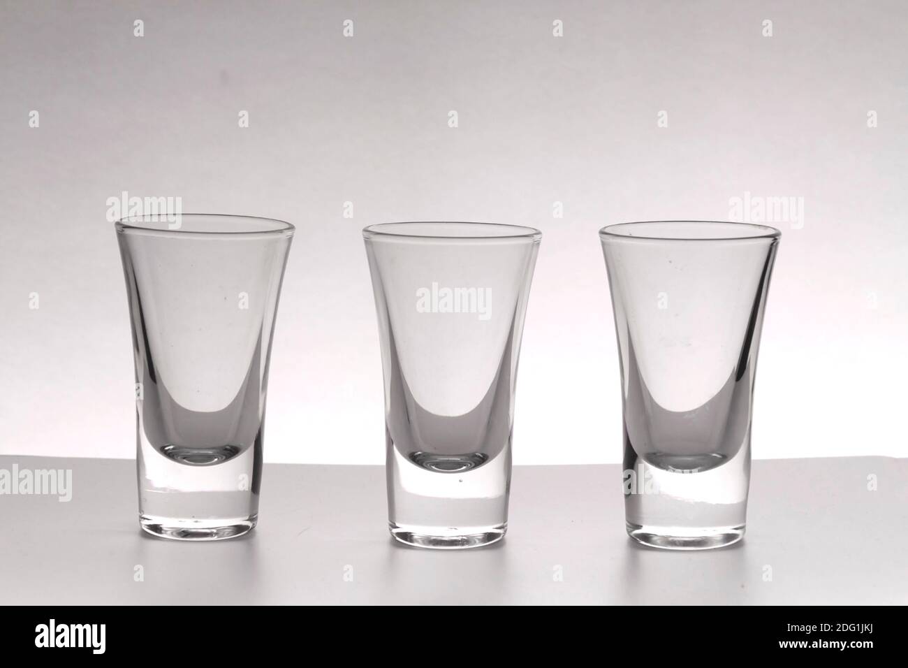 Three alcoholic multicolored alcoholic shots for advertising layout ...