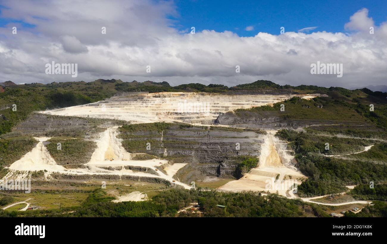 A multi-level limestone quarry in the mountainous part of Bohol Island ...