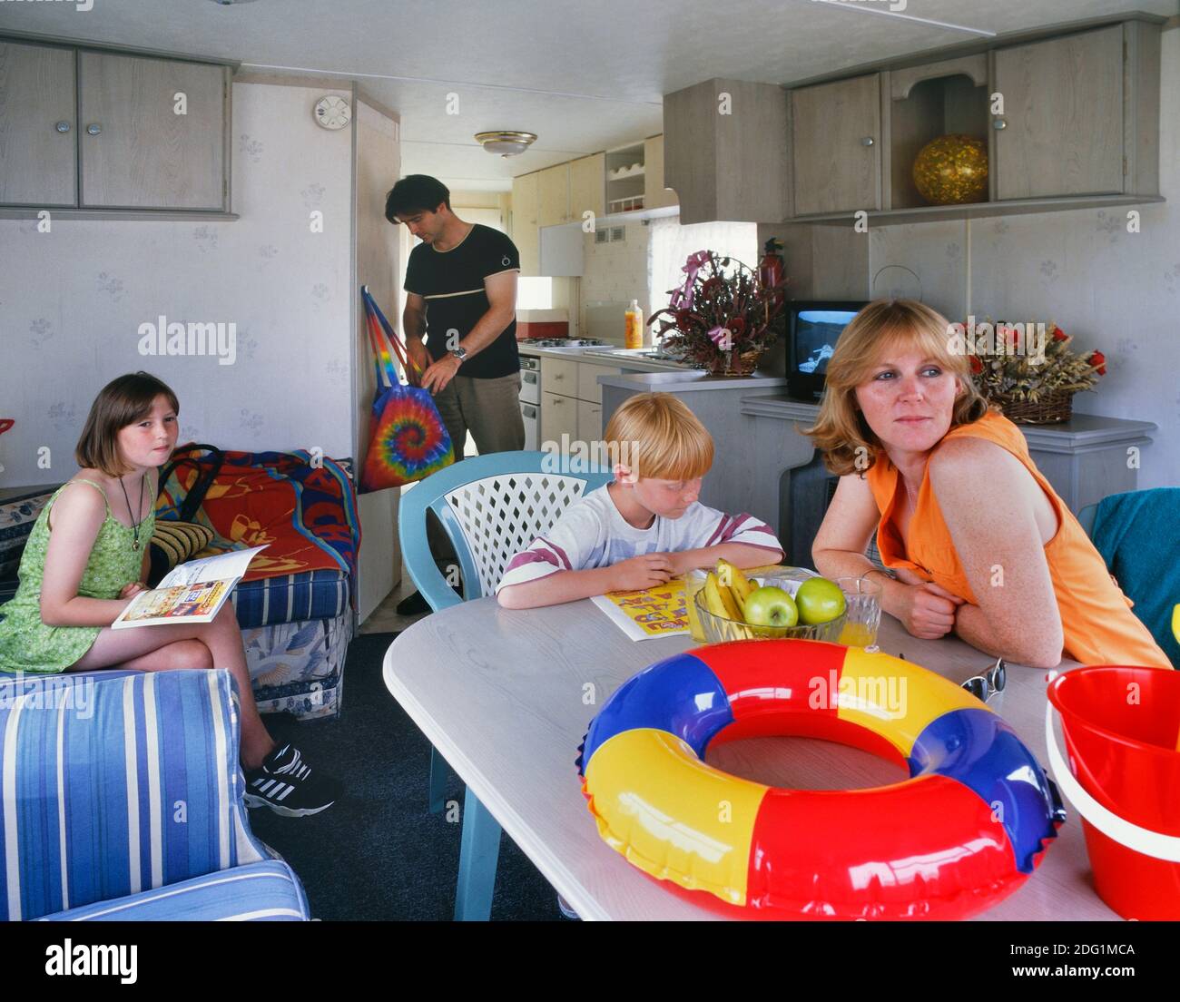 A young family inside a static caravan on holiday, England, UK Stock ...