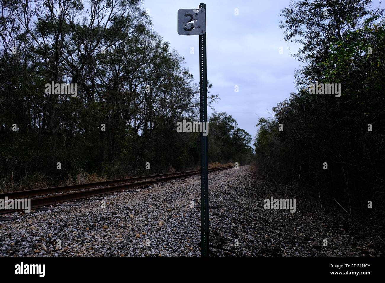railroad with a sign that says 3 Stock Photo - Alamy