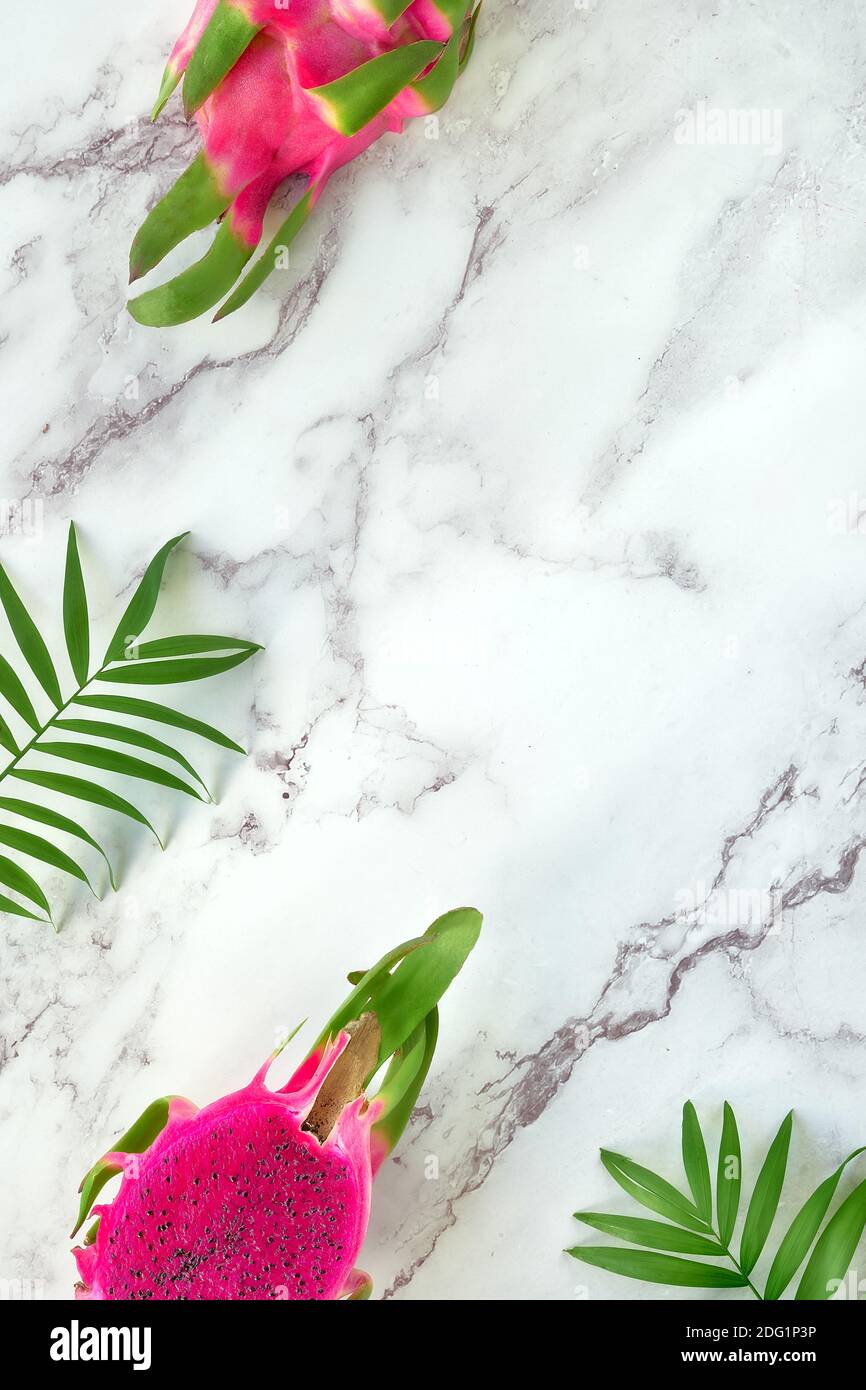 Pink dragon fruit, pitaya, pitahaya trendy flat lay on marble ...