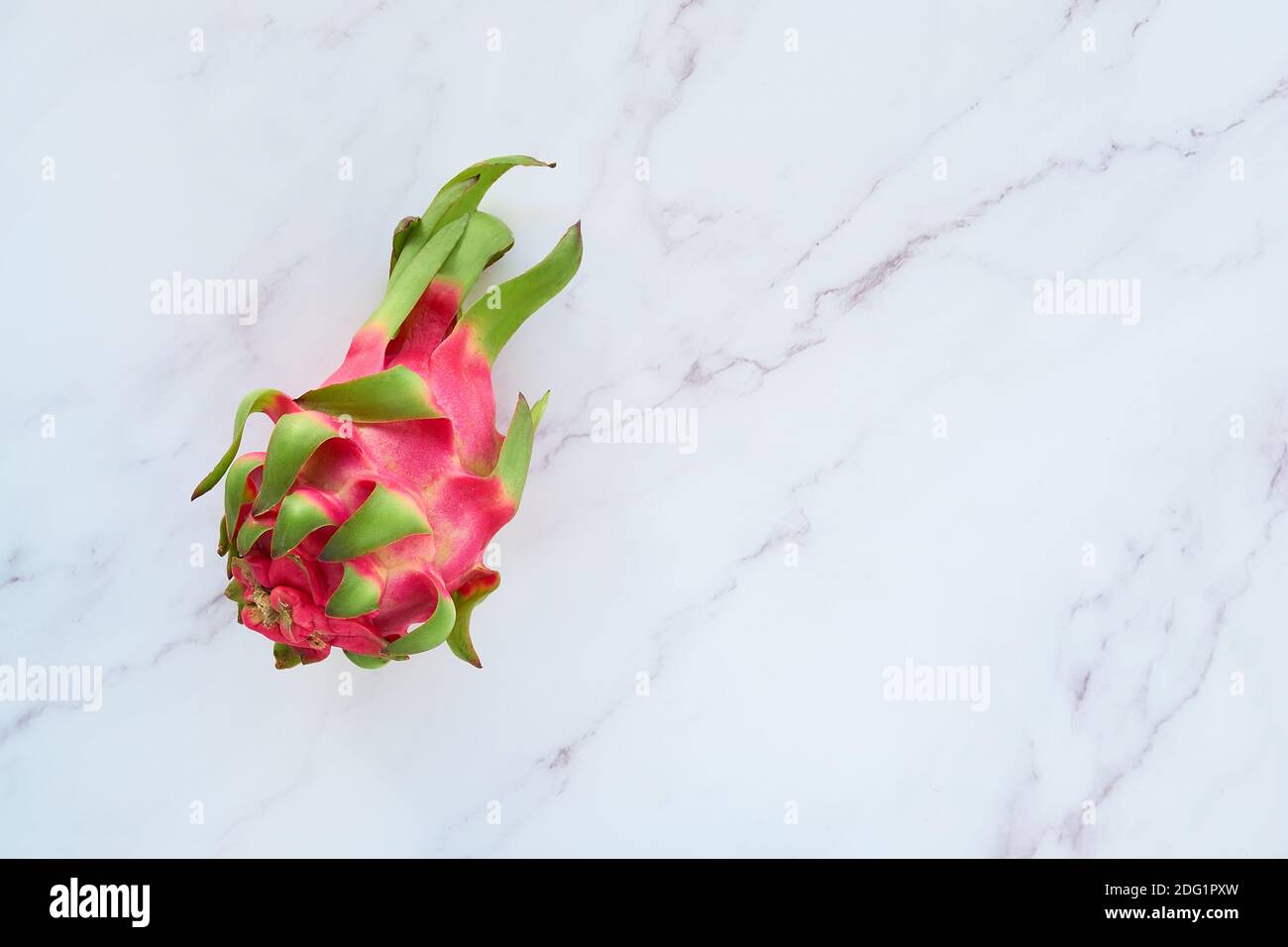 Creative flat layout with fresh organic pink dragon fruit, pitaya or ...