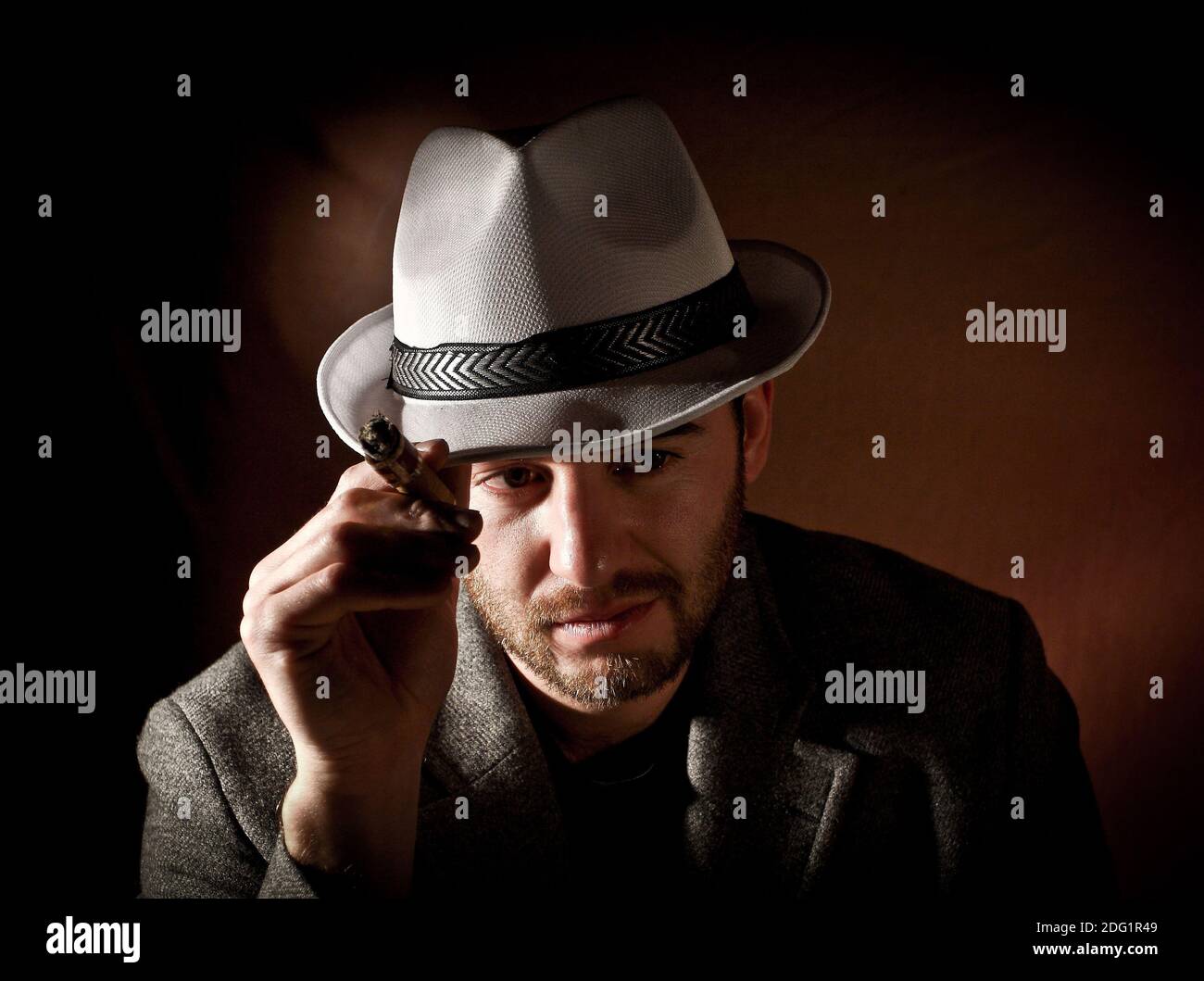 Young gangster hat smoking cigar hi-res stock photography and images ...