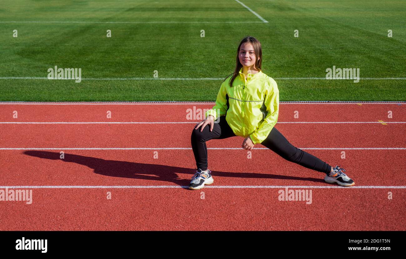 healthy child girl training fitness on stadium running track, sport ...