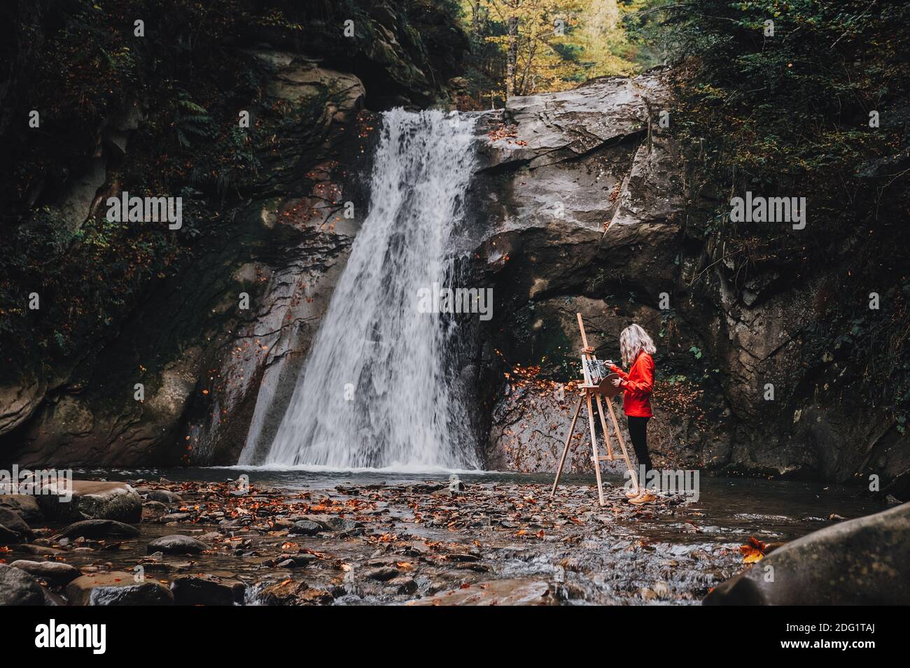 Woman Painter Artist Painting A Picture Close to a Waterfall Stock ...