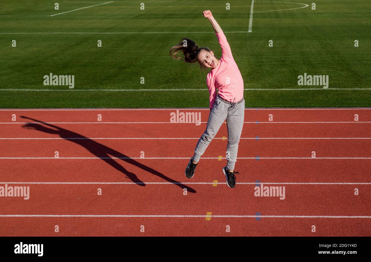 happy winner. runner on competition celebrate success. sprinter won on ...