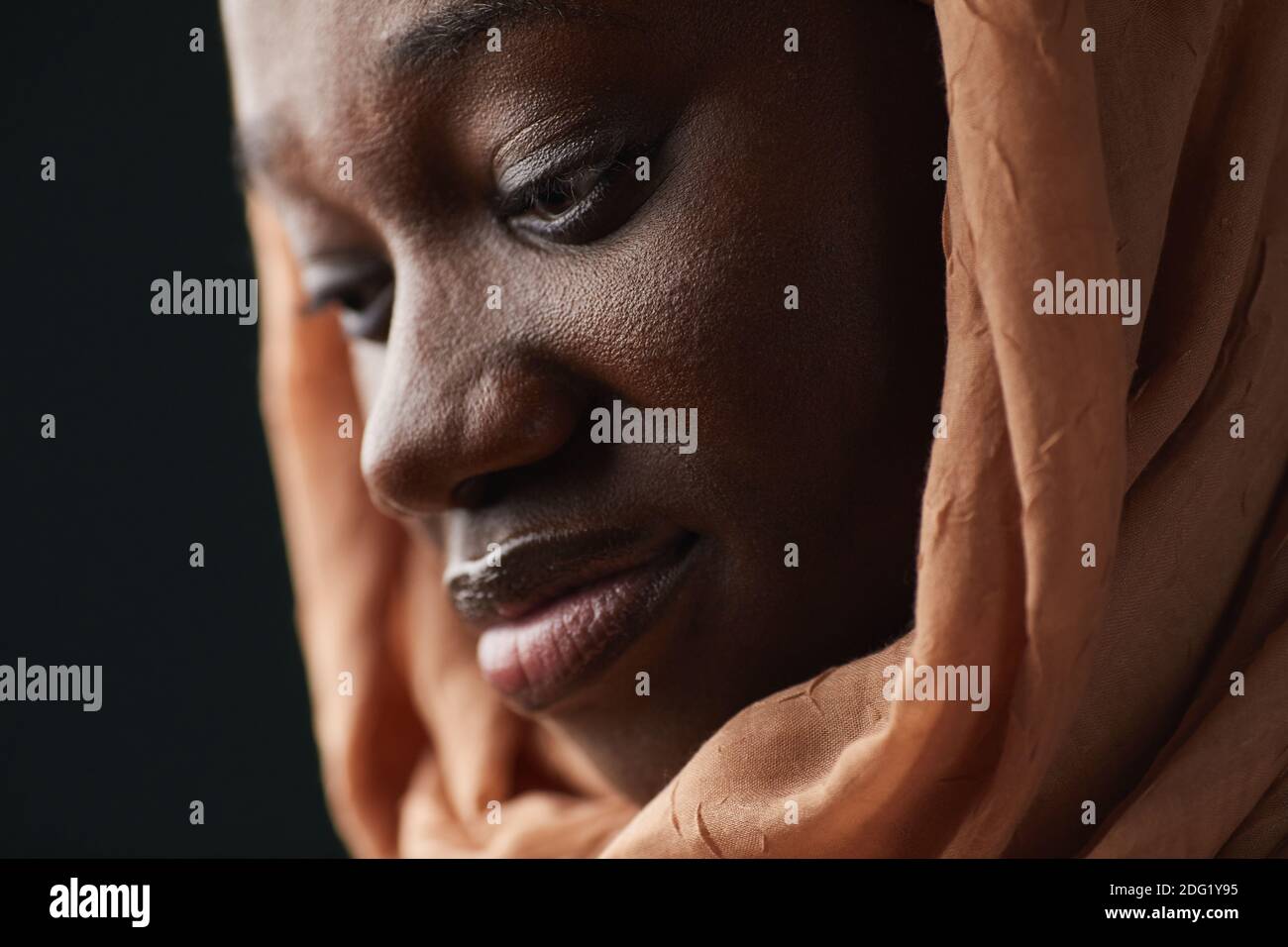 Extreme close up portrait of ethnic African-American woman wearing ...