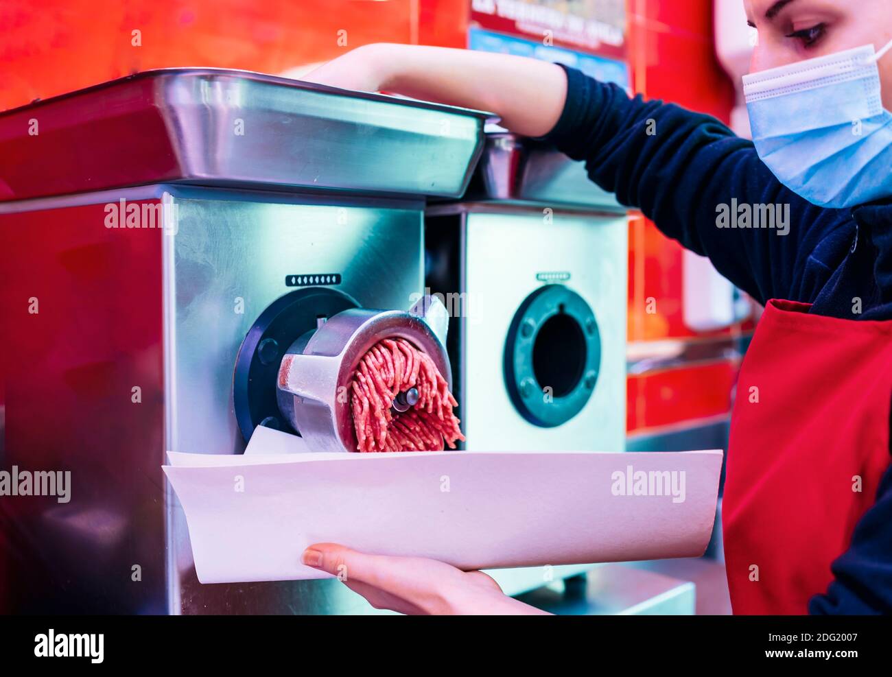 butcher woman mincing meat mincer Stock Photo - Alamy
