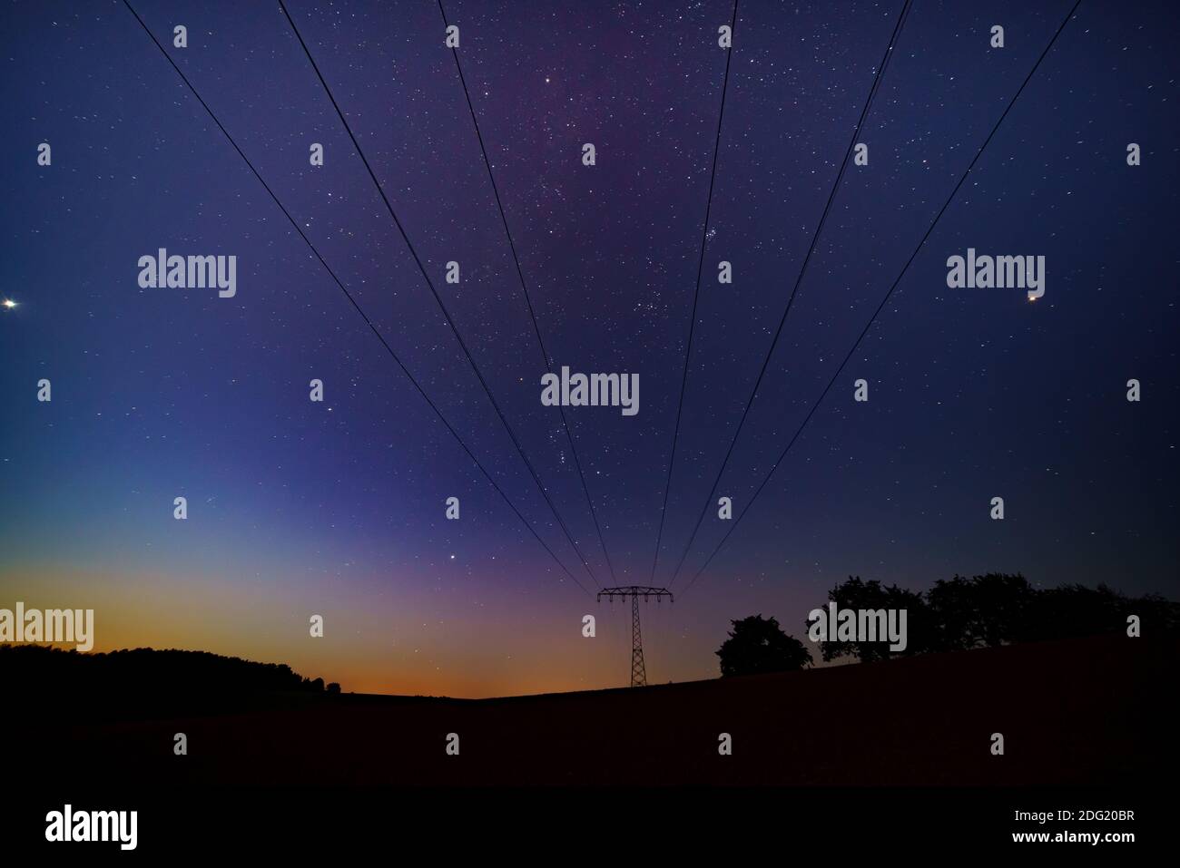 Night landscape with power lines on the starry sky Stock Photo - Alamy