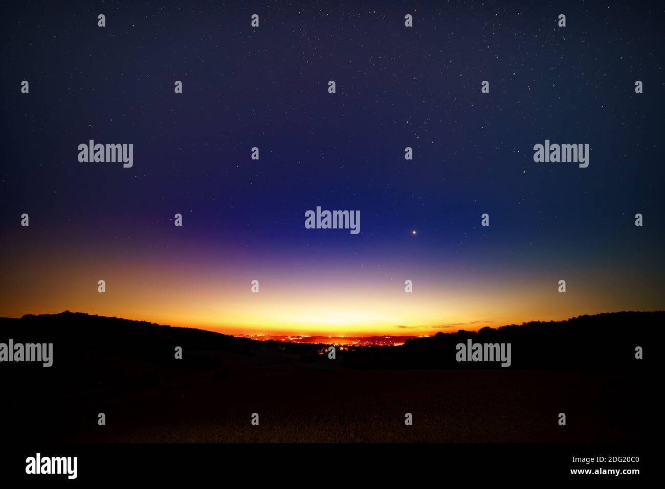 Night landscape with light from the city on the horizon Stock Photo - Alamy