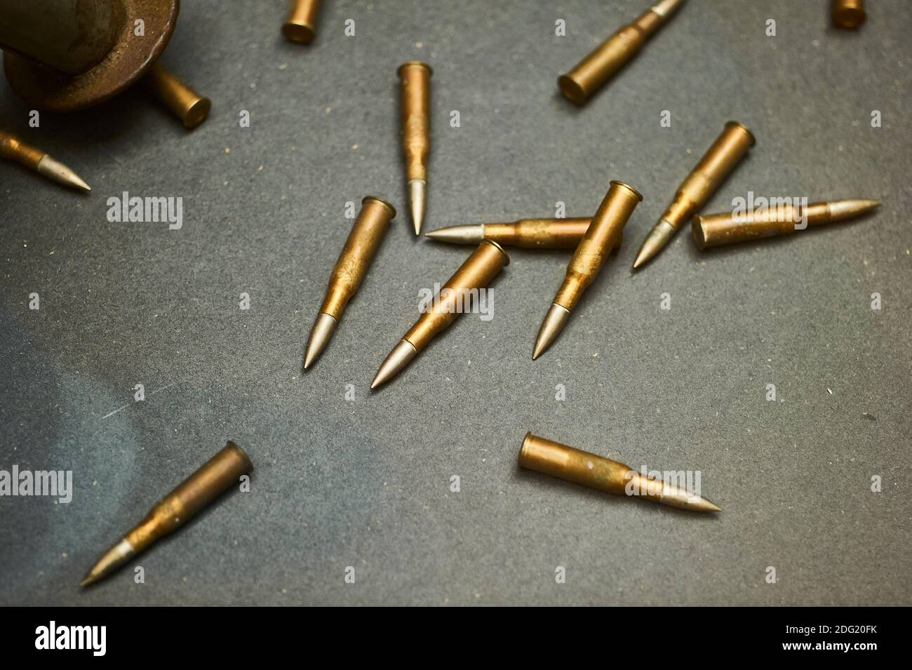 Several large-caliber bullets lying in a chaotic Stock Photo - Alamy