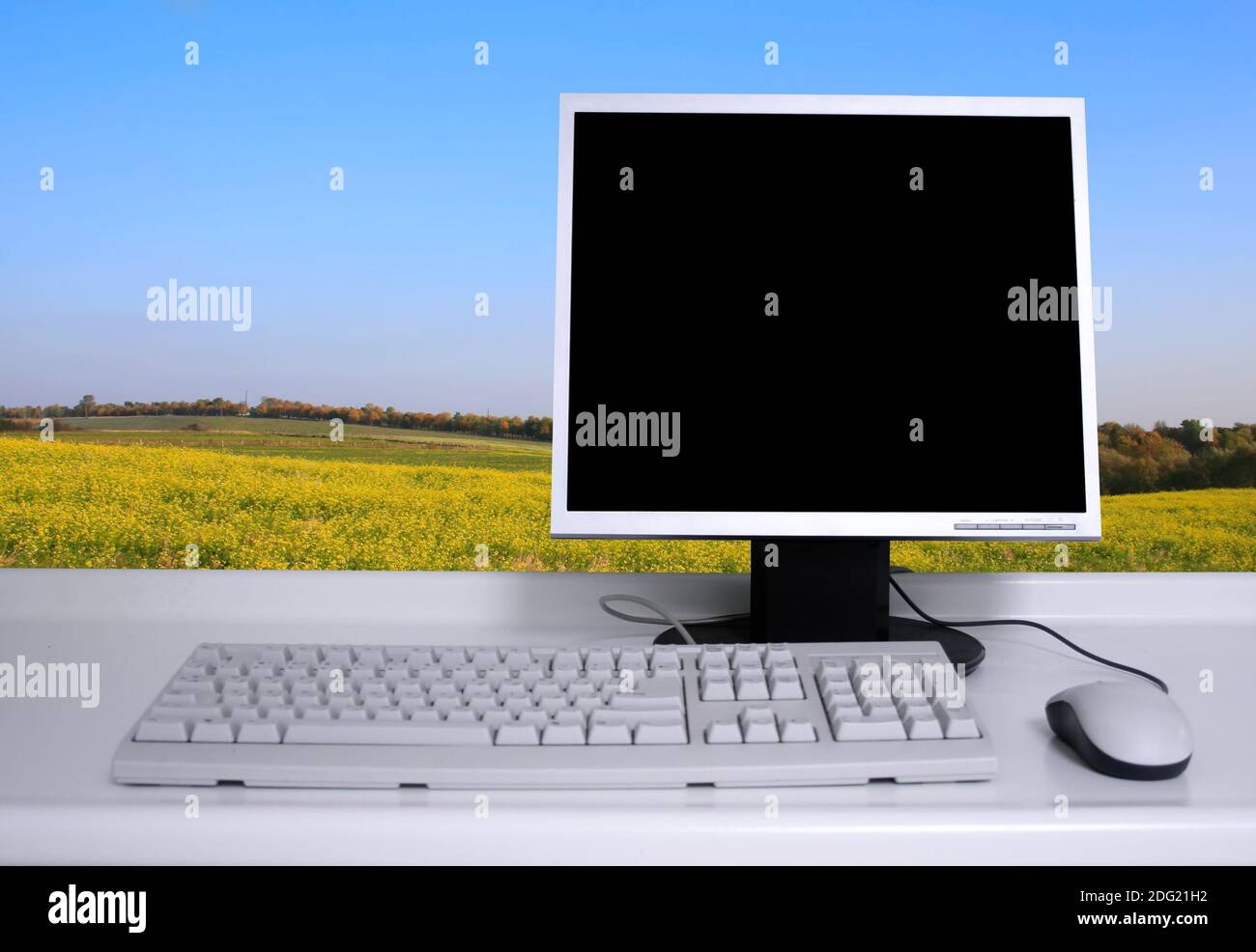PC with black desktop and green field background Stock Photo - Alamy