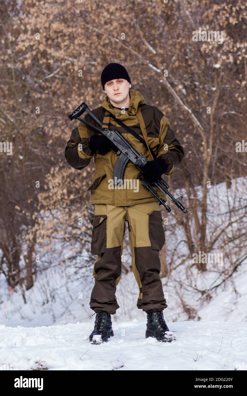 Soldier holding kalashnikov rifle hi-res stock photography and images ...