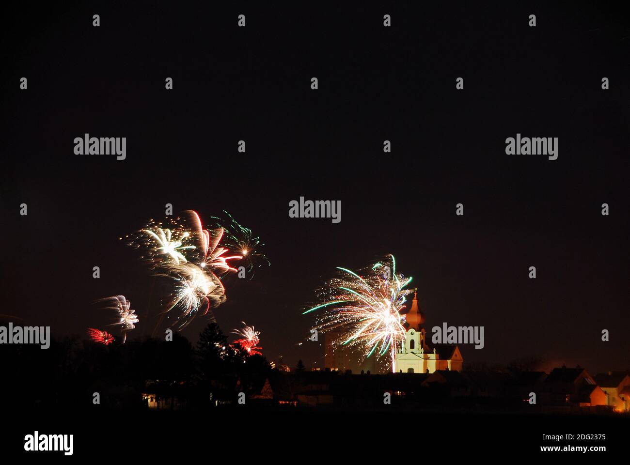 Fireworks with a church on the left Stock Photo - Alamy