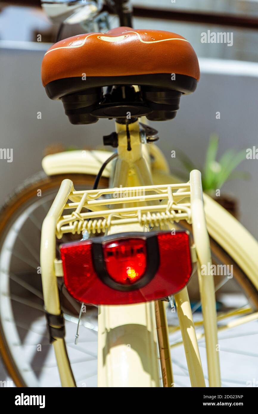 A vertical closeup of a bicycle from behind w Stock Photo - Alamy