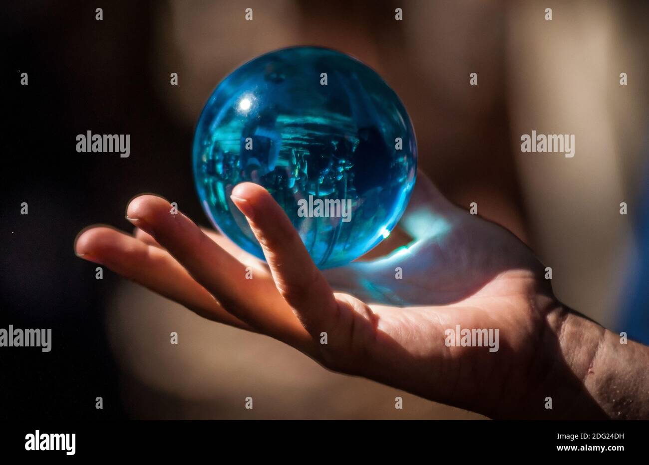 Crystal ball in hand Stock Photo - Alamy