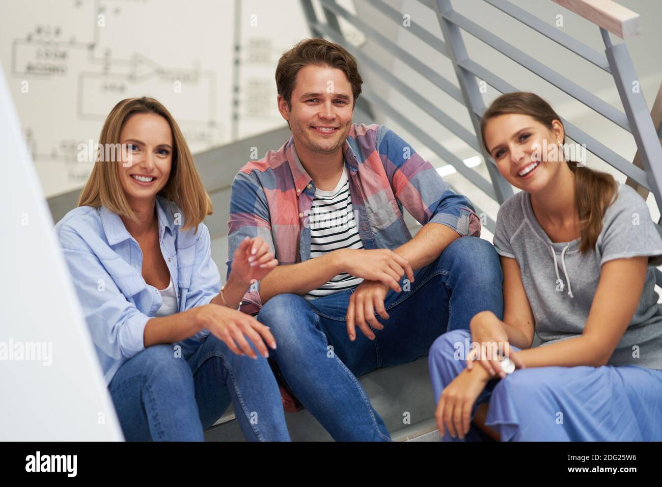 Group of students relaxing in the campus Stock Photo - Alamy