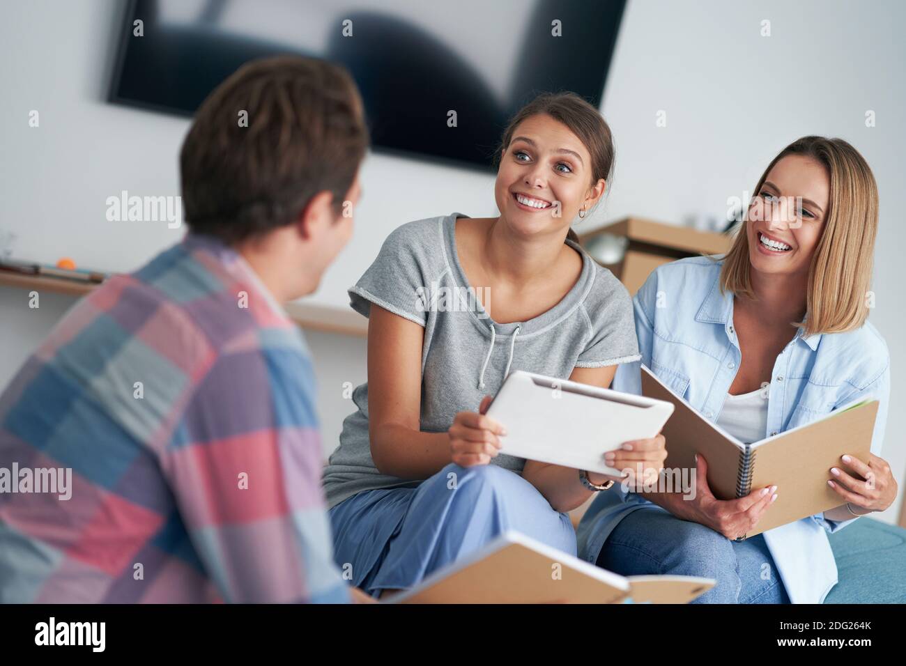 Group of students studying together in the campus Stock Photo - Alamy