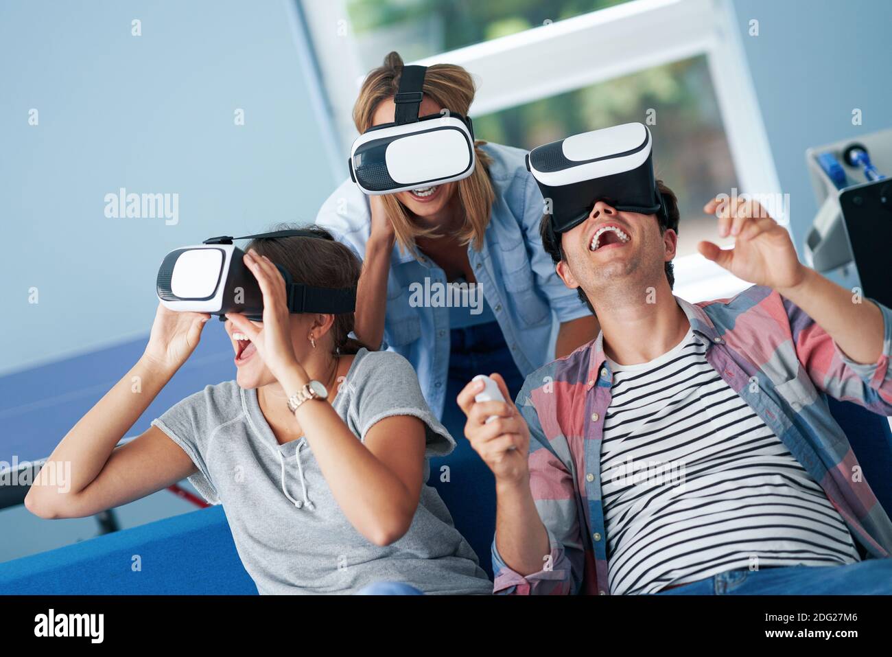 Couple of students playing video games in the campus Stock Photo - Alamy