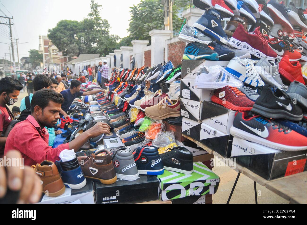 Customers are busy buying winter clothes at street shops in Sylhet ...