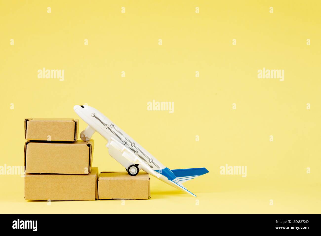 Airplane and stack of cardboard boxes. concept of air cargo and parcels ...