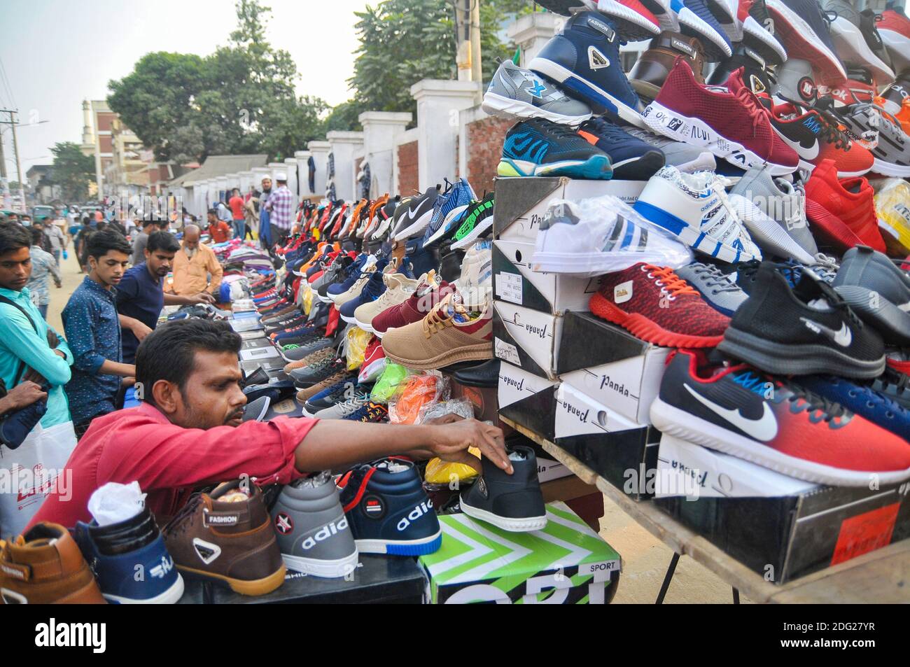 Customers are busy buying winter clothes at street shops in Sylhet ...