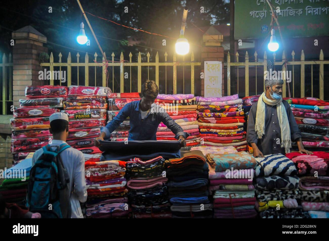 Customers are busy buying winter clothes at street shops in Sylhet ...