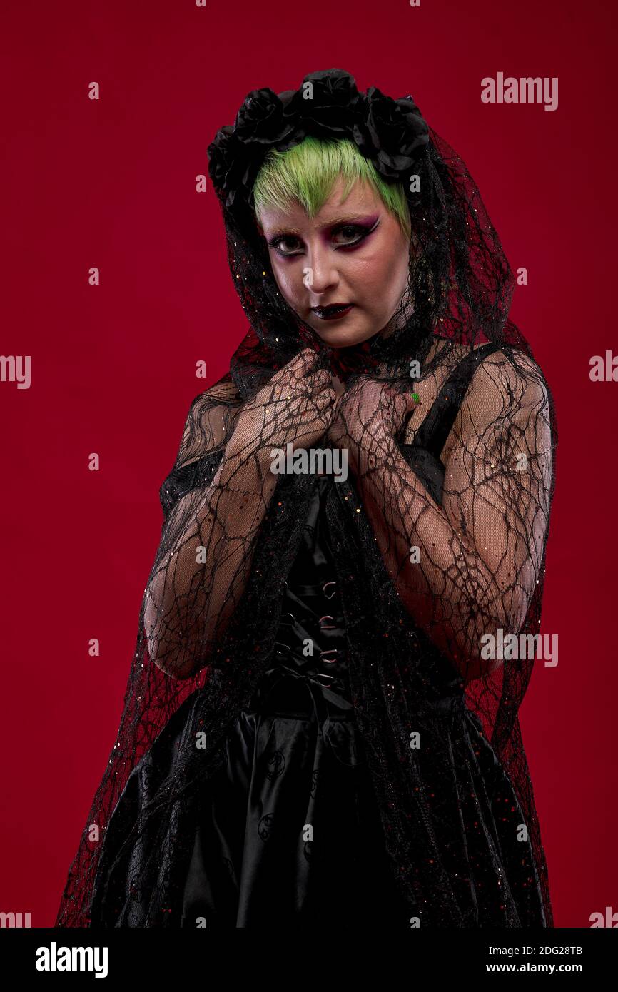Woman dressed in gothic clothes, scary halloween Stock Photo - Alamy