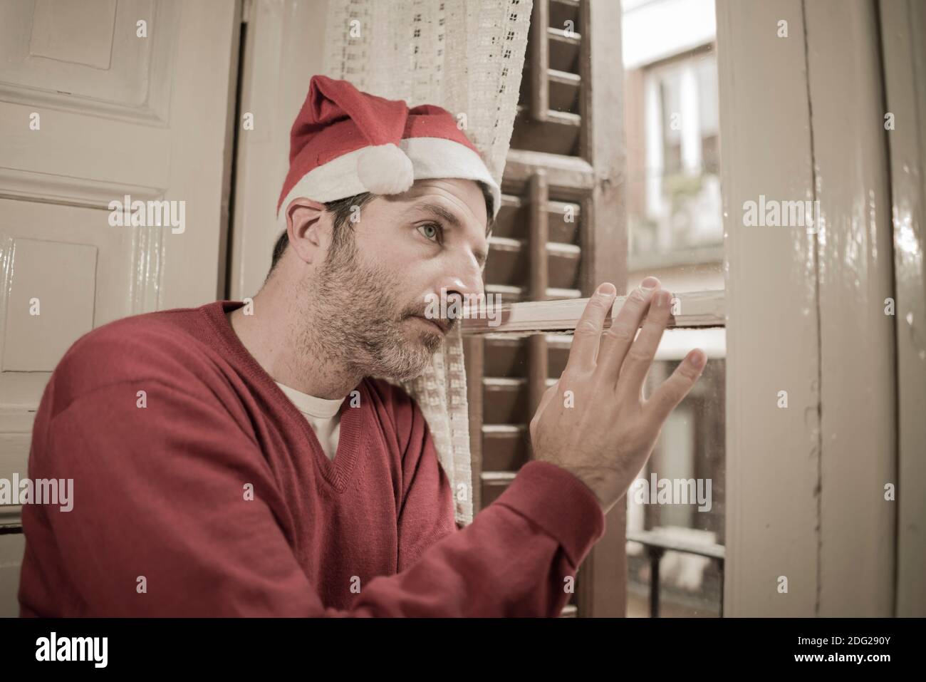 dramatic lifestyle portrait of sad and depressed man in Santa Claus hat ...