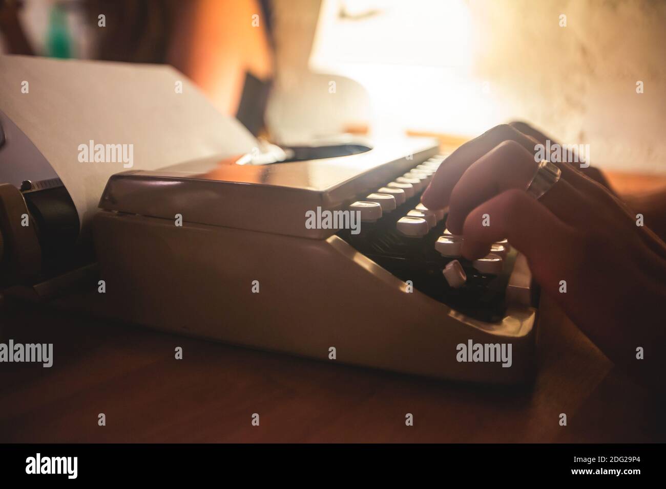 Process of writing a text letter on a white sheet of paper with old ...