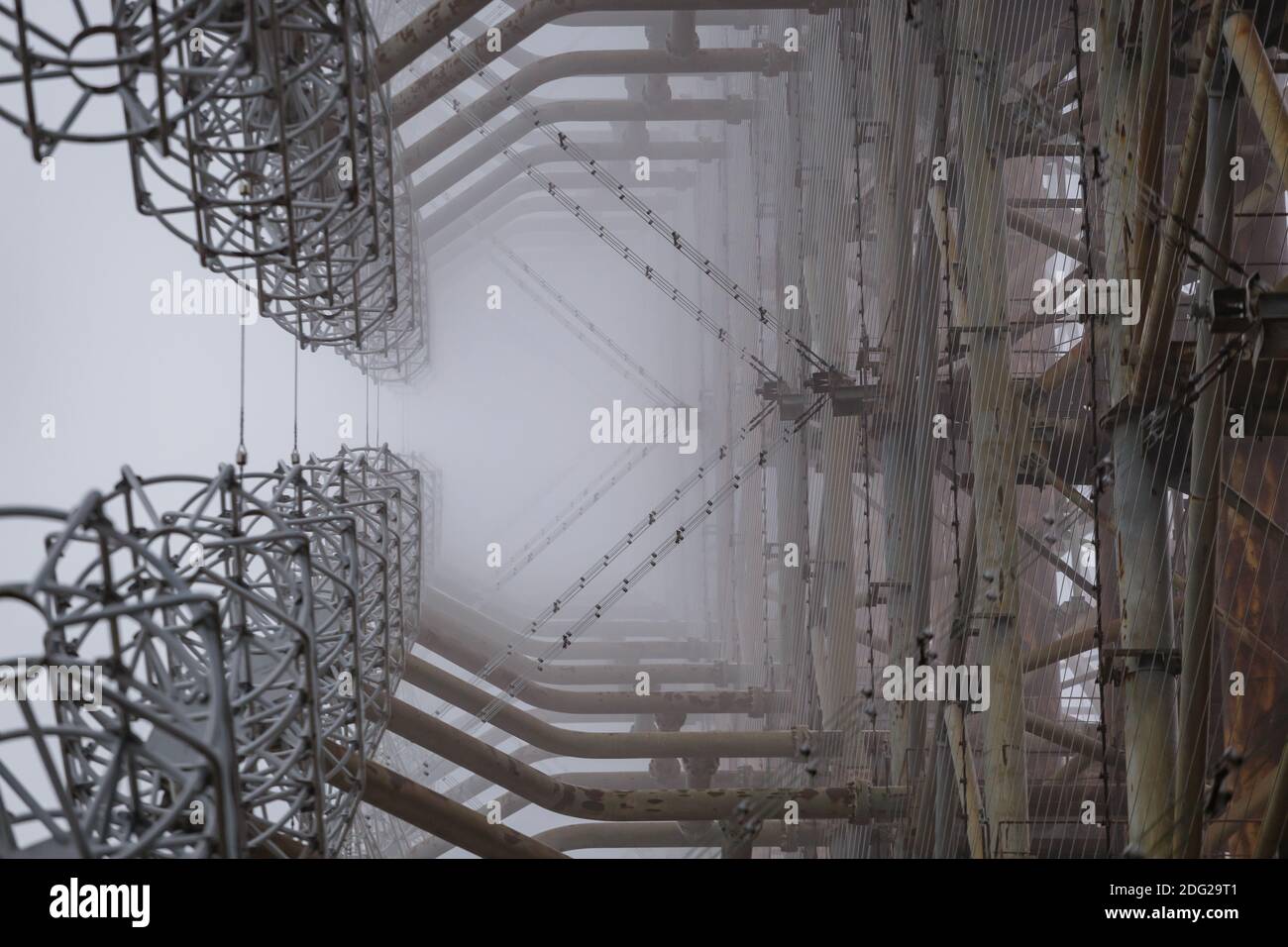 Soviet radar Duga in foggy weather. Russian woodpecker - over-the ...