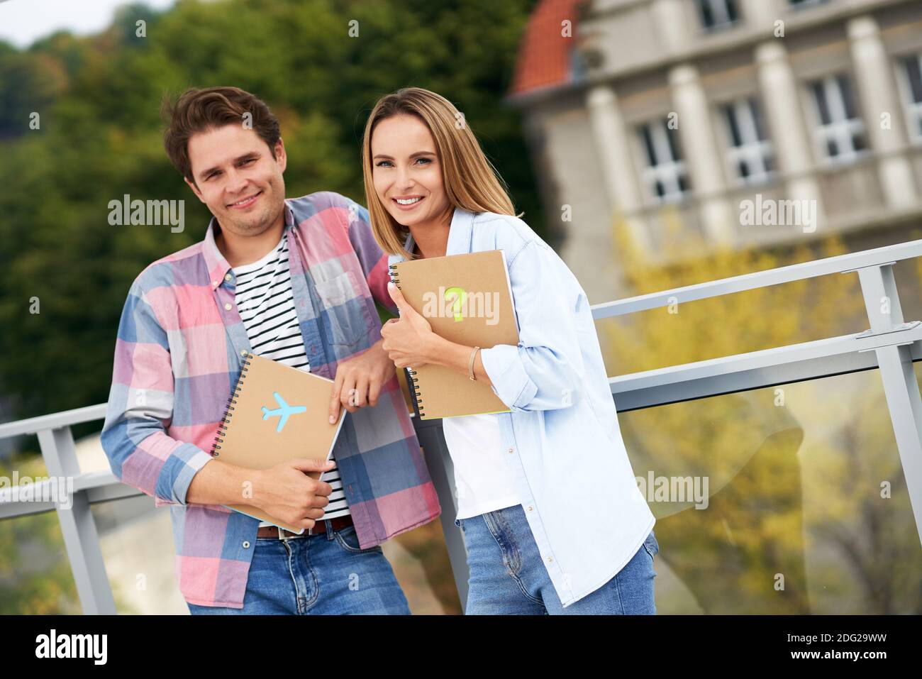 Couple of students standing together in the campus Stock Photo - Alamy