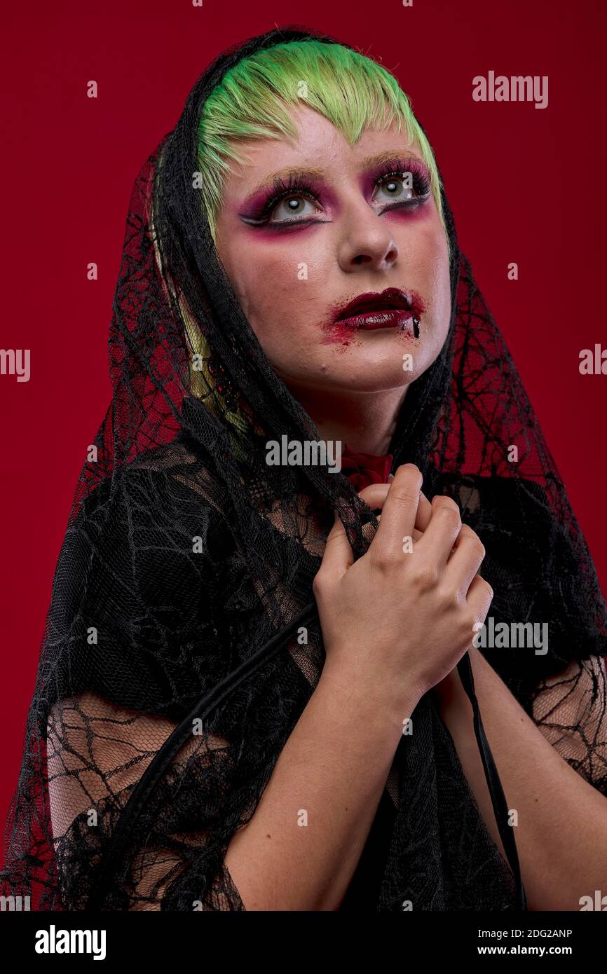 Woman dressed in gothic clothes, scary halloween Stock Photo - Alamy