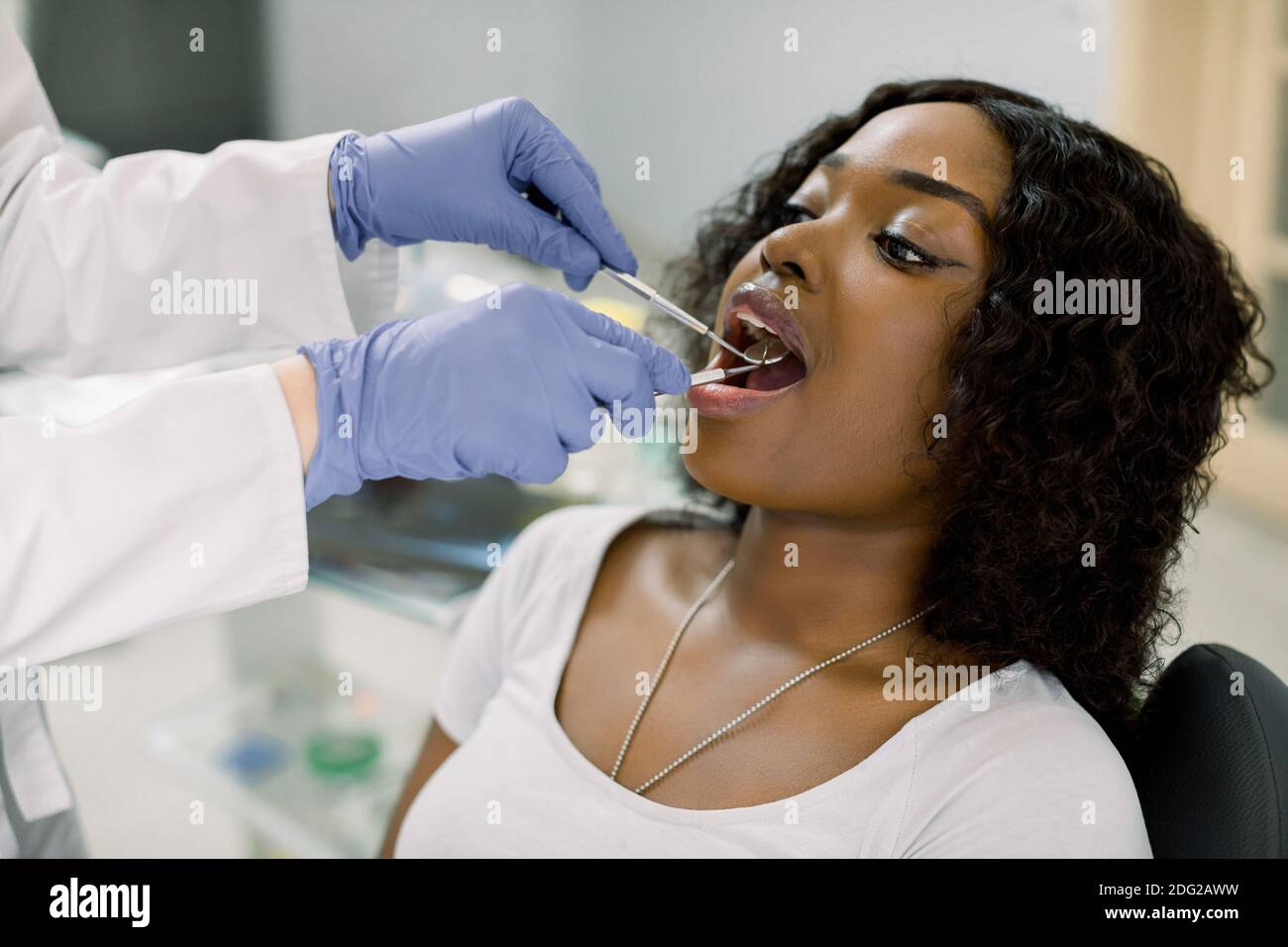 Dental and healthcare concept. Close up cropped shot of pretty african ...