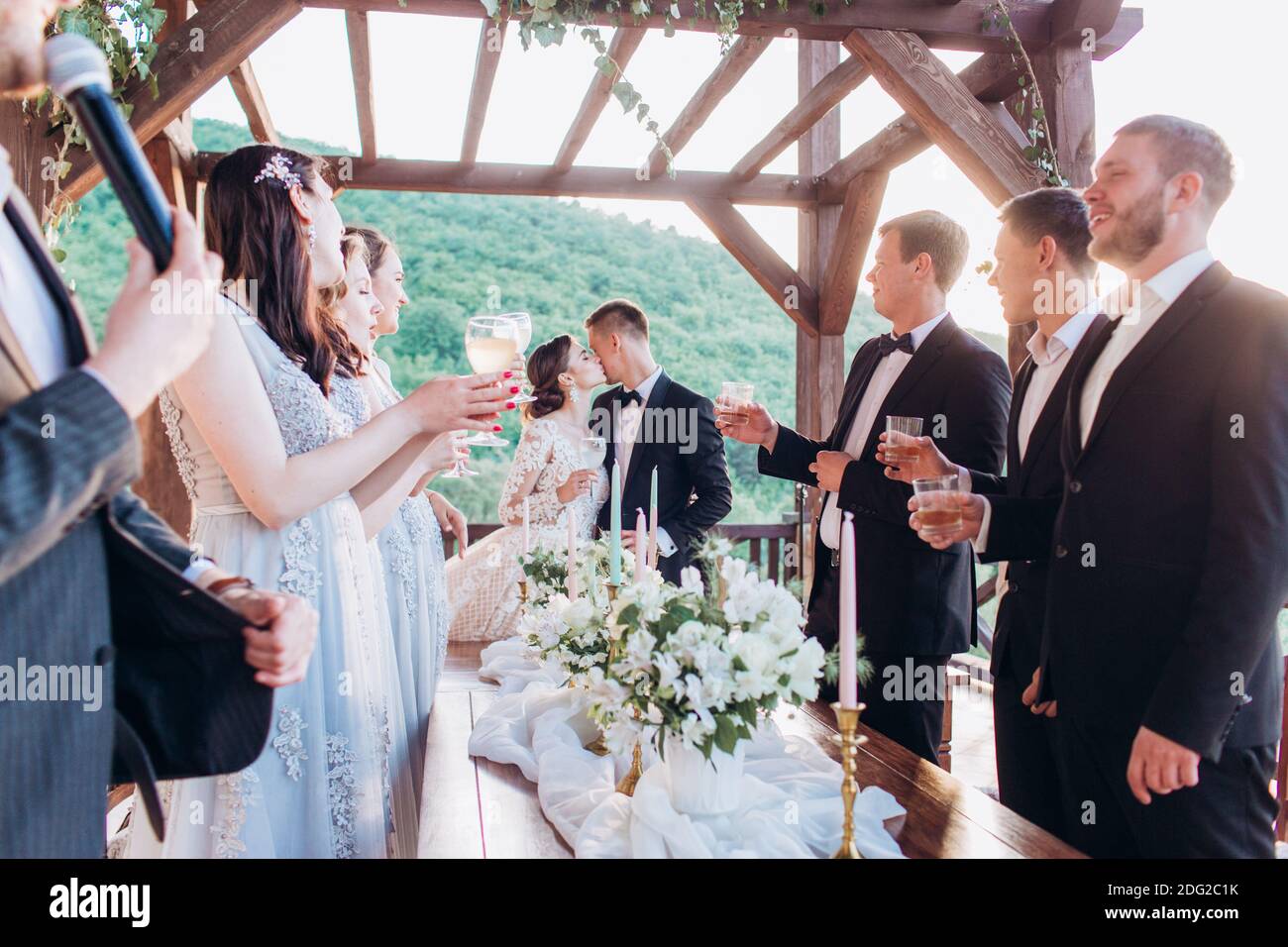 Boho style wedding party. Banquet with friends, bride and groom Stock ...