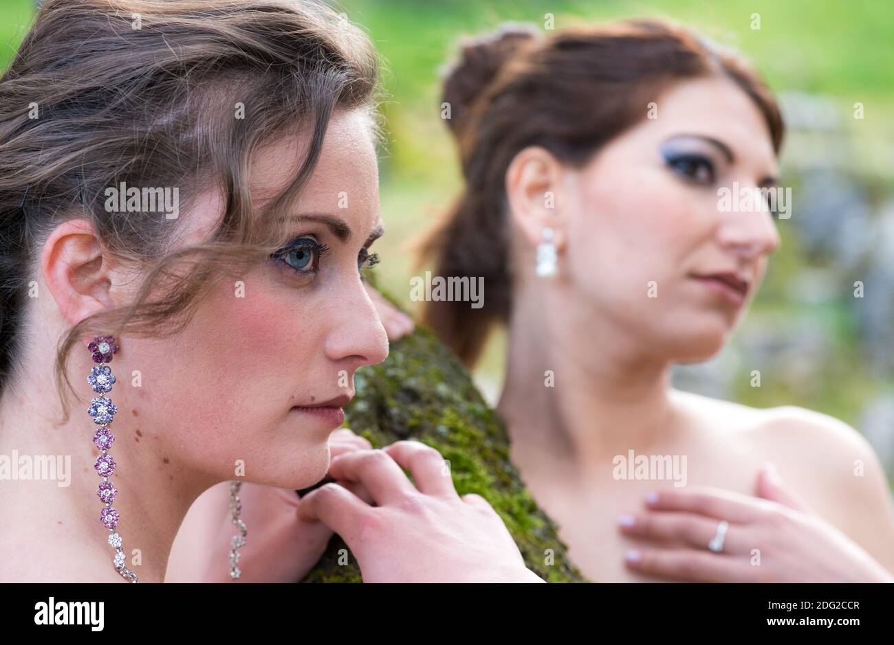Two beautiful young women relaxing outdoor in spring season Stock Photo ...