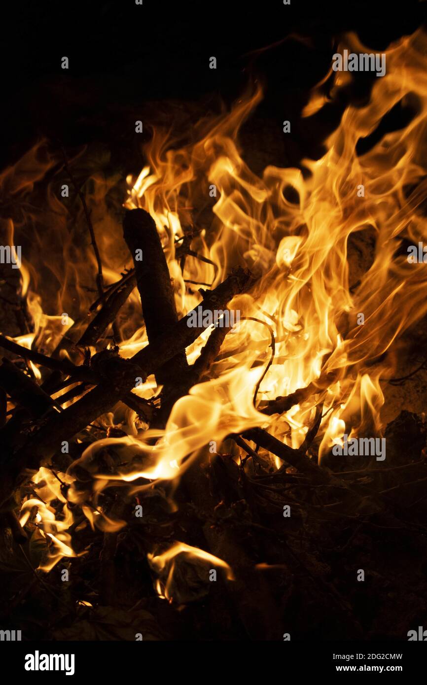 A vertical shot of a bonfire at the ni Stock Photo - Alamy