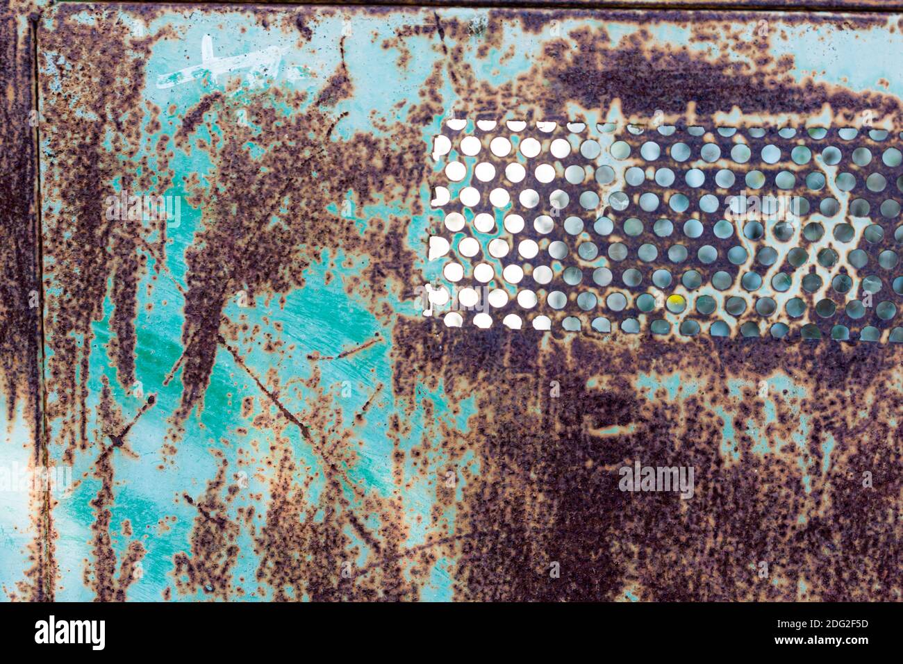 Detail of a rusty metal door with grille Stock Photo - Alamy