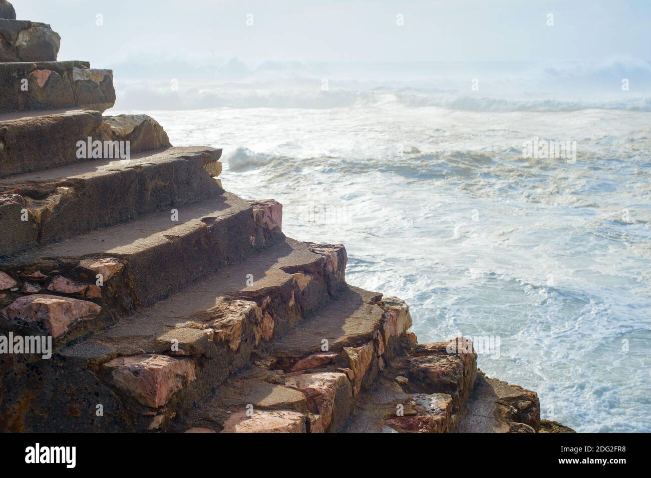 Stone stairs and the ocean in the background. Nazare, Portugal Stock ...