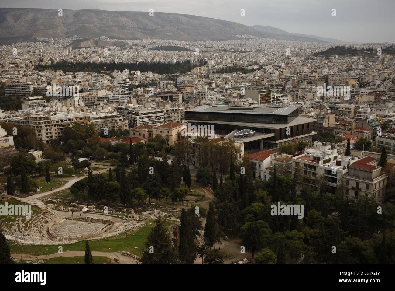 The Theatre of Dionysus Eleuthereus, left, and Acropolis Museum, right ...