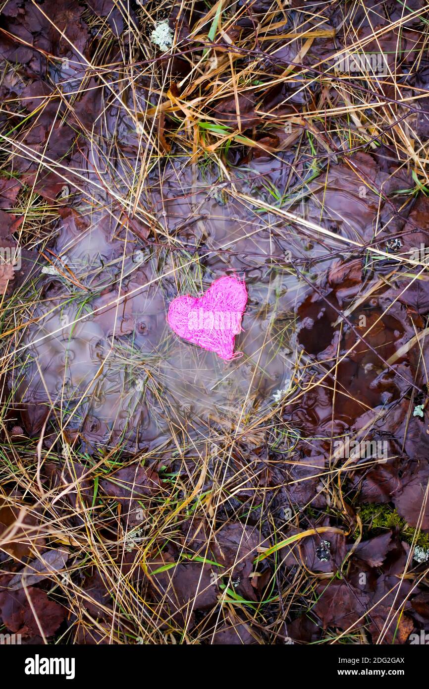 Small colorful heart in a puddle Stock Photo - Alamy